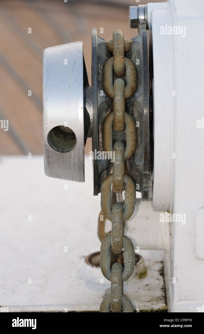 Capstan with chain used on a boat to keep it anchored Stock Photo - Alamy