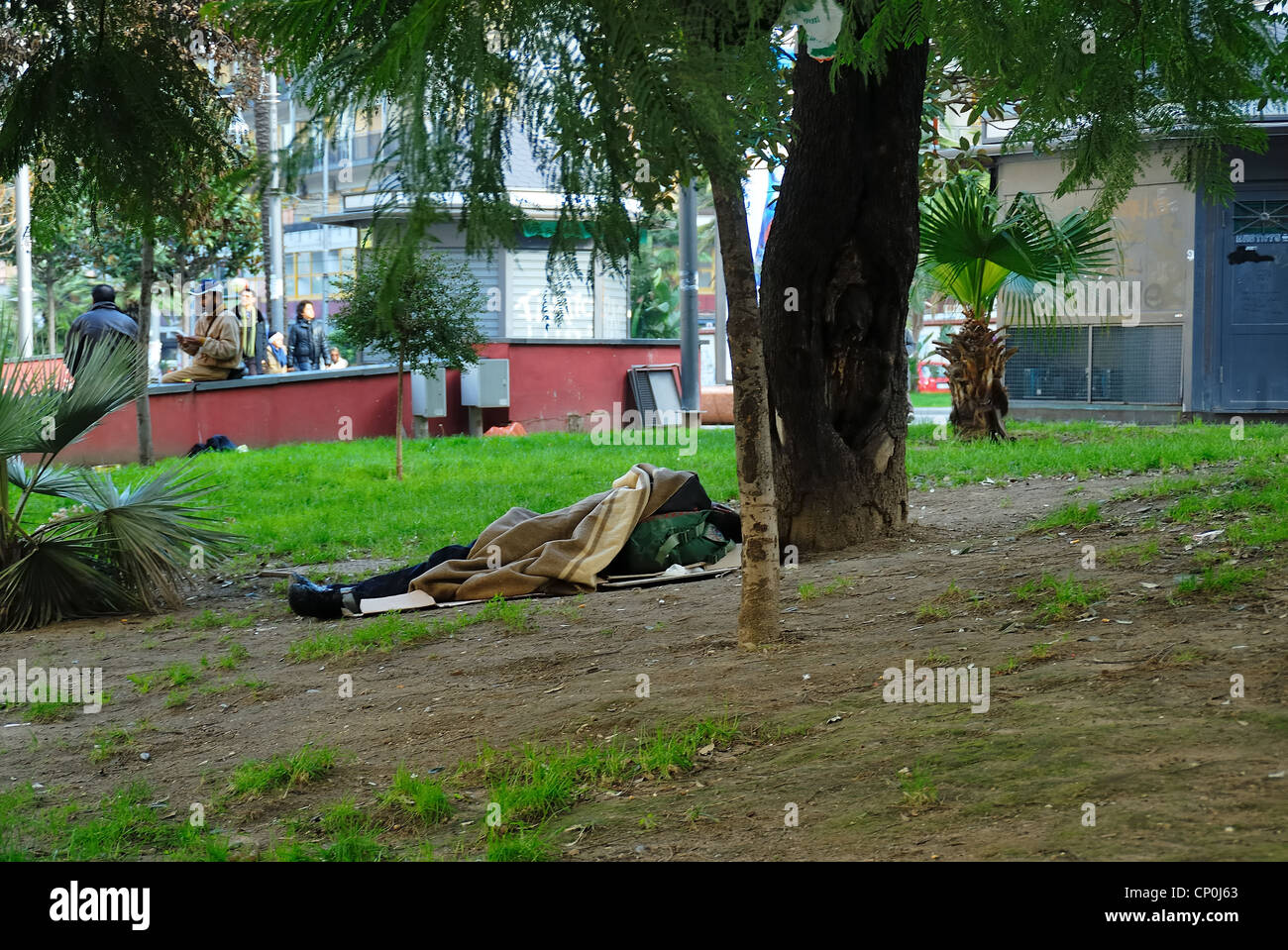 A homeless sleeping in the public gardens of Naples Stock Photo - Alamy