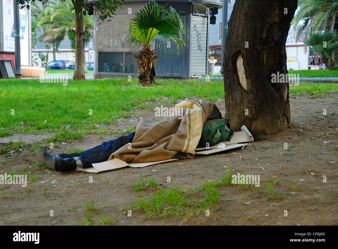 A homeless sleeping in the public gardens of Naples Stock Photo - Alamy