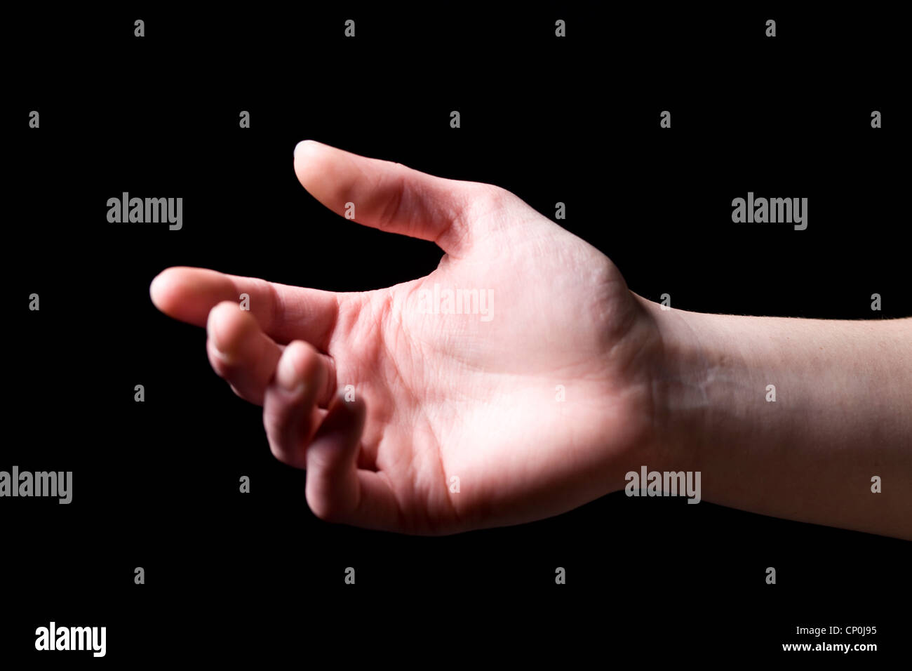 Female hand photographed against a black backdrop Stock Photo - Alamy