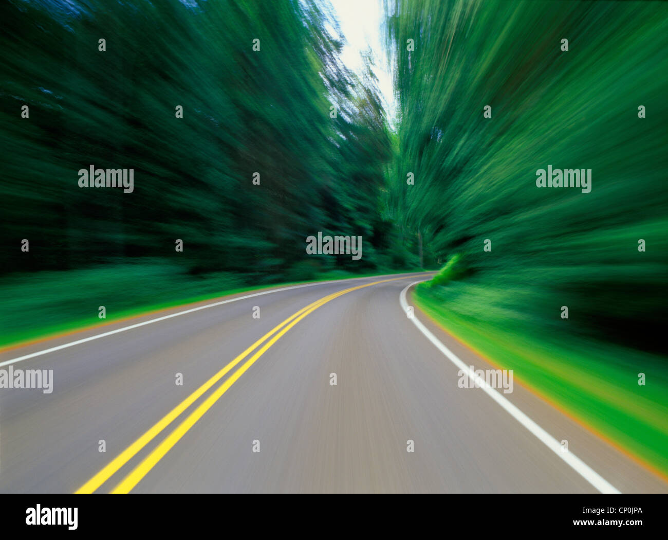 Curving road with blur and motion effect, autumn, Mohican State Park ...