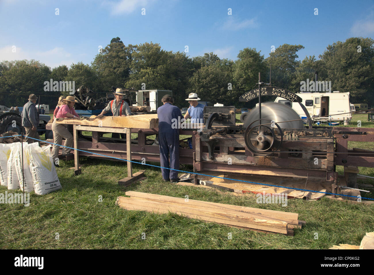 Outdoor saw bench sawing large log Stock Photo - Alamy