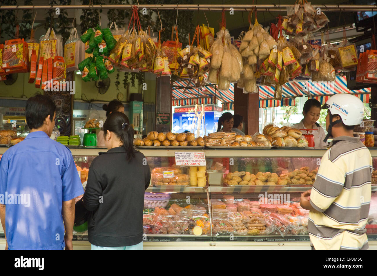Woman at counter waiting for customers hi-res stock photography and ...