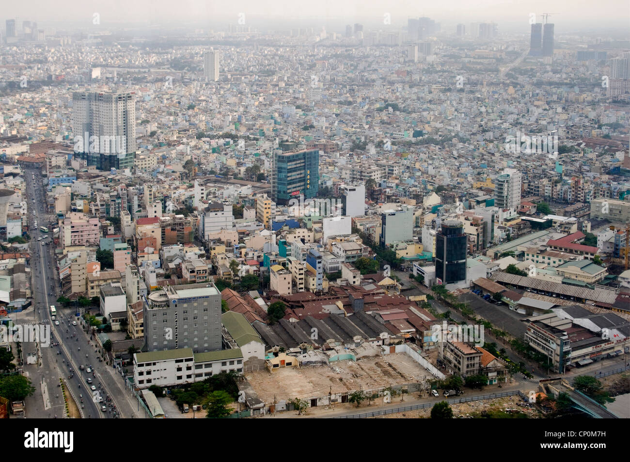 Horizontal aerial view over the rooftops of Ho Chi Minh City , Vietnam ...