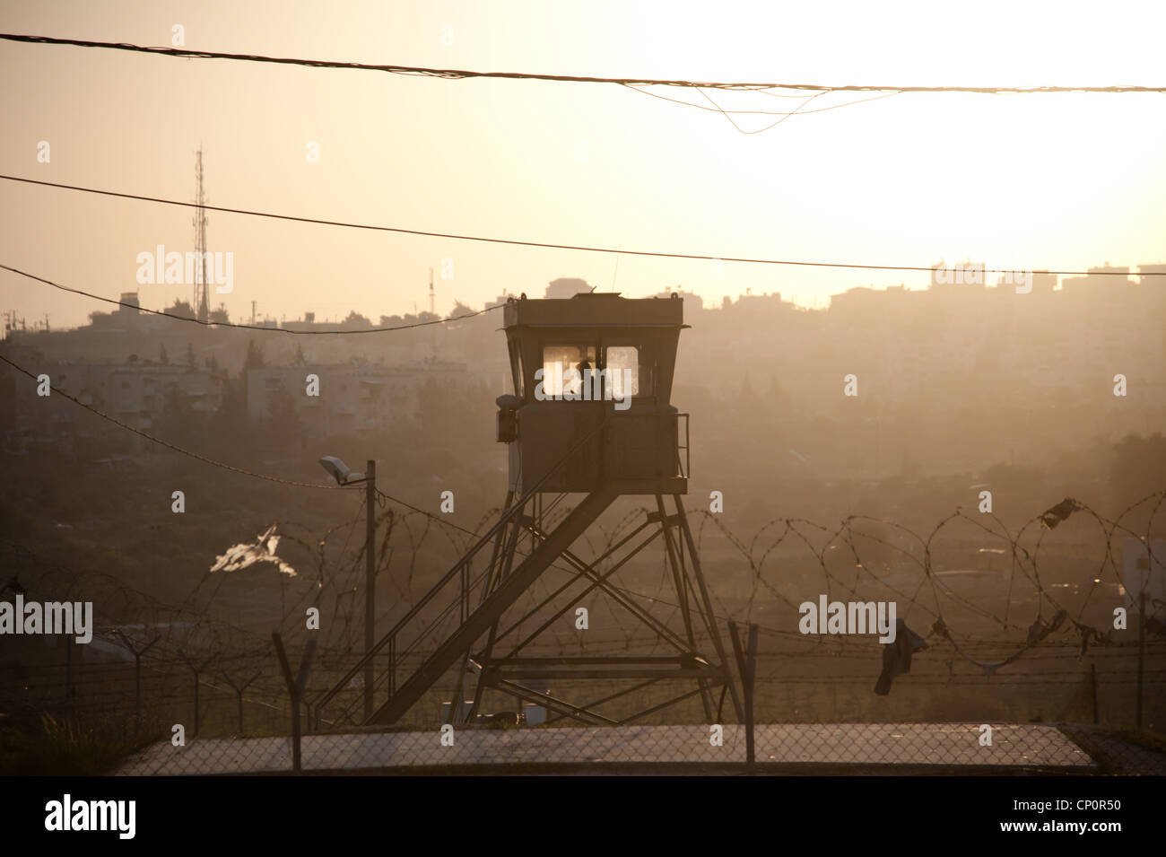 An Israeli watchtower rises from a military base near the settlement of ...