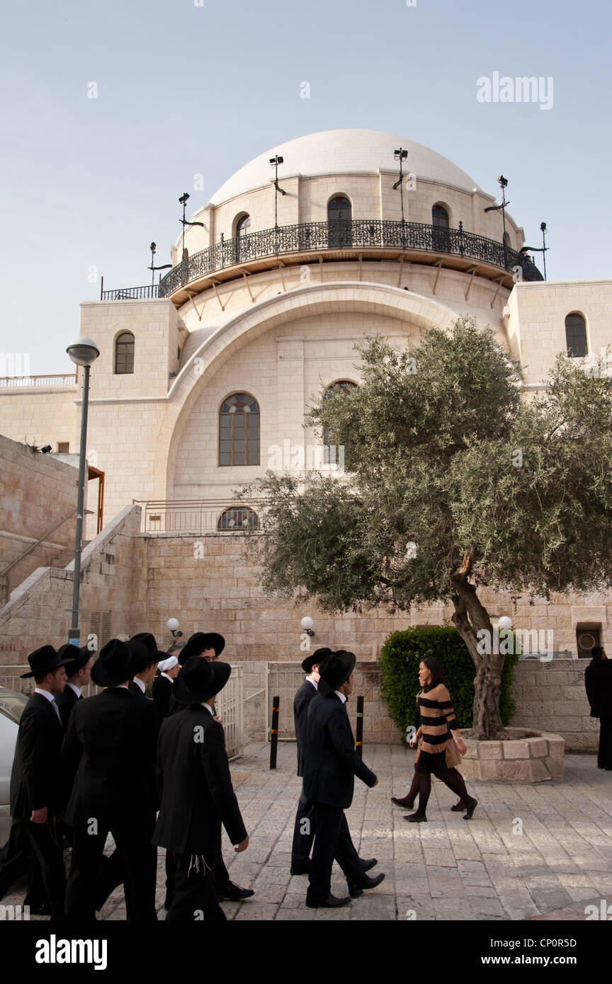 Ultra-orthodox Jewish men walk near the Hurva Synagogue in the Jewish ...