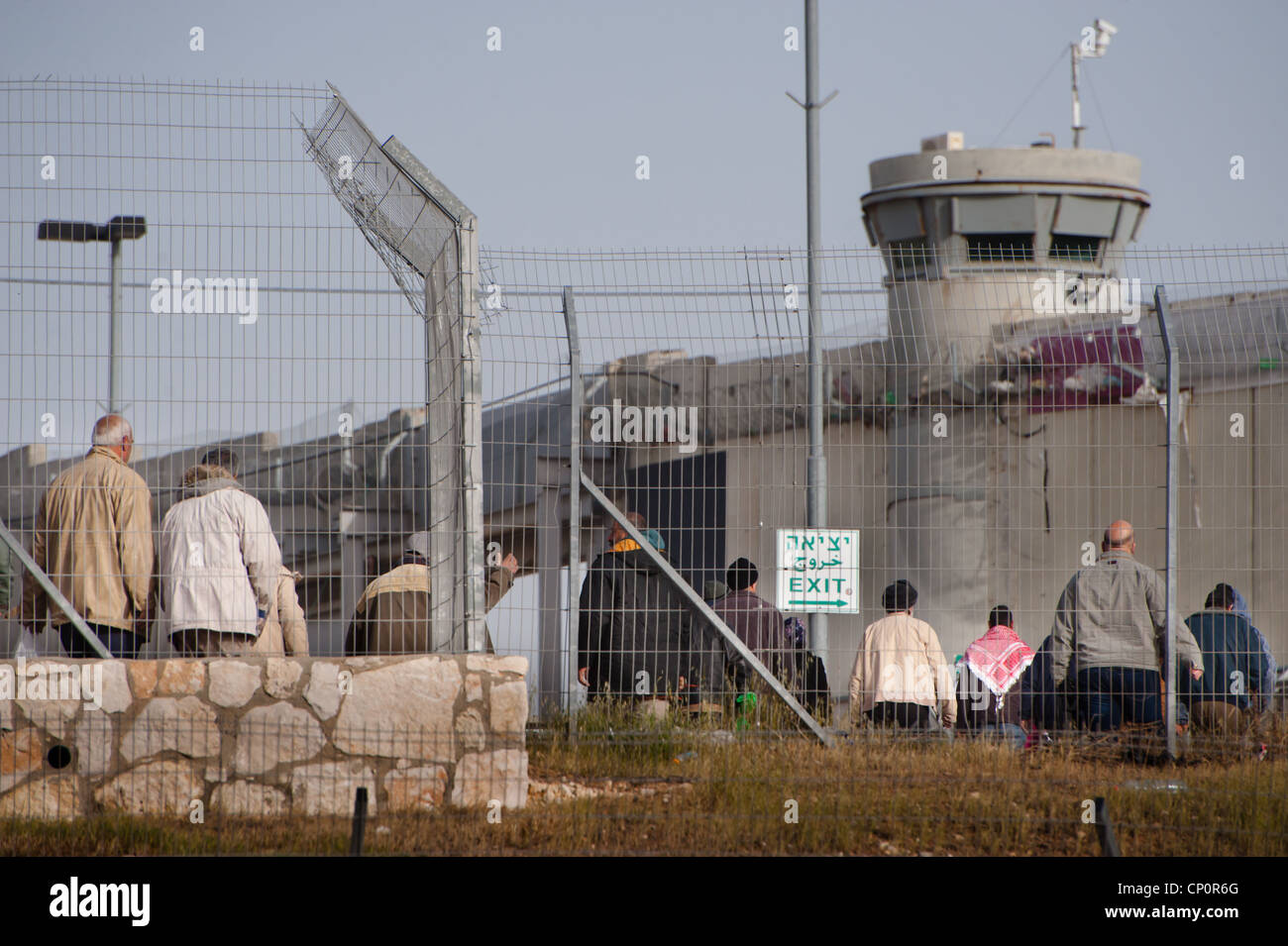 Palestinians pass through the Israeli checkpoint that controls movement ...