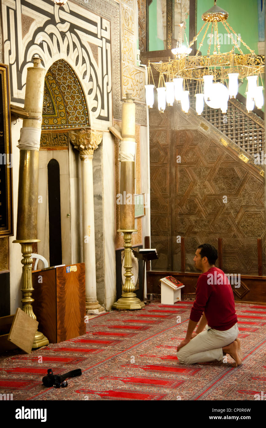 A Muslim worshiper prays in the Al-Ibrahimi Mosque in the Old City of ...