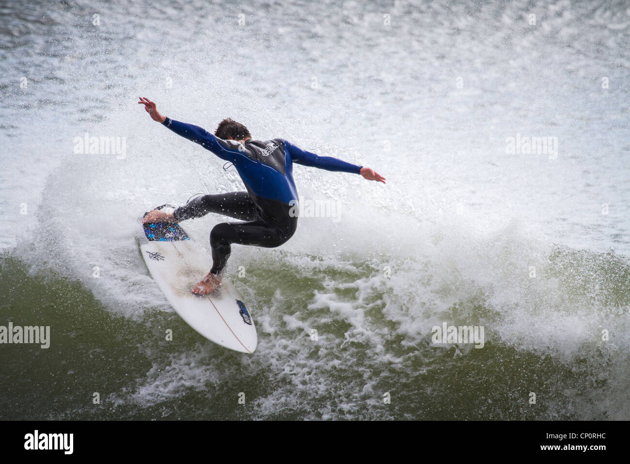 surfer in blue wetsuit at Porthleven, Cornwall Stock Photo - Alamy