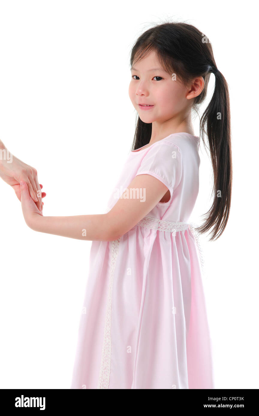 Asian girl holding her mother's hand Stock Photo - Alamy