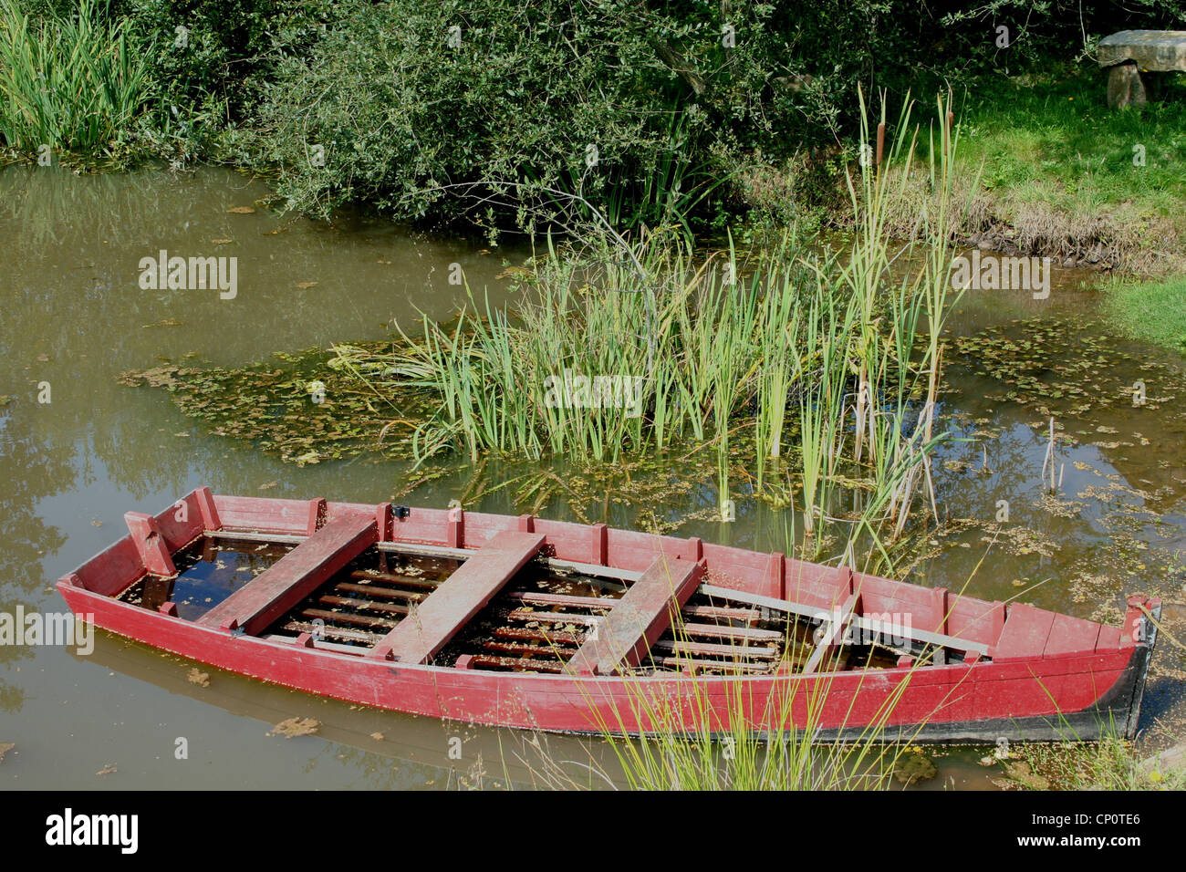 Sinking Red boat Stock Photo - Alamy