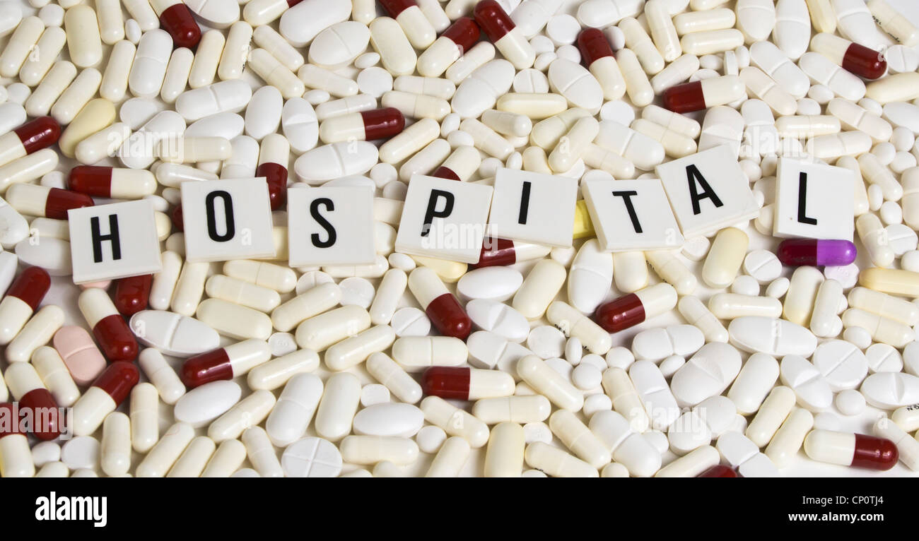 text hospital written over pills Stock Photo - Alamy