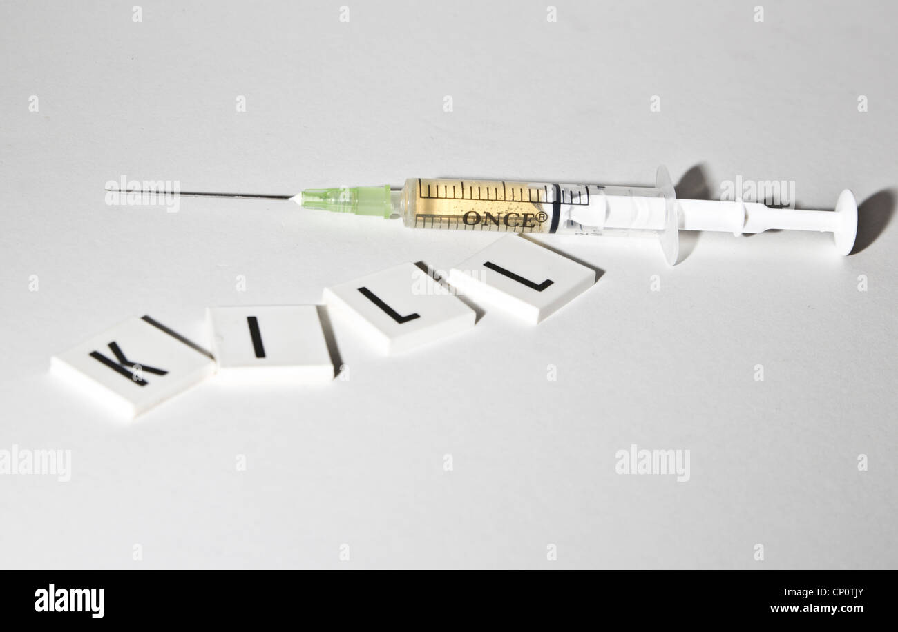 medical syringe with text kill Stock Photo - Alamy