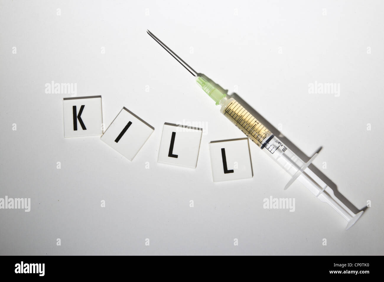 medical syringe with text kill Stock Photo - Alamy