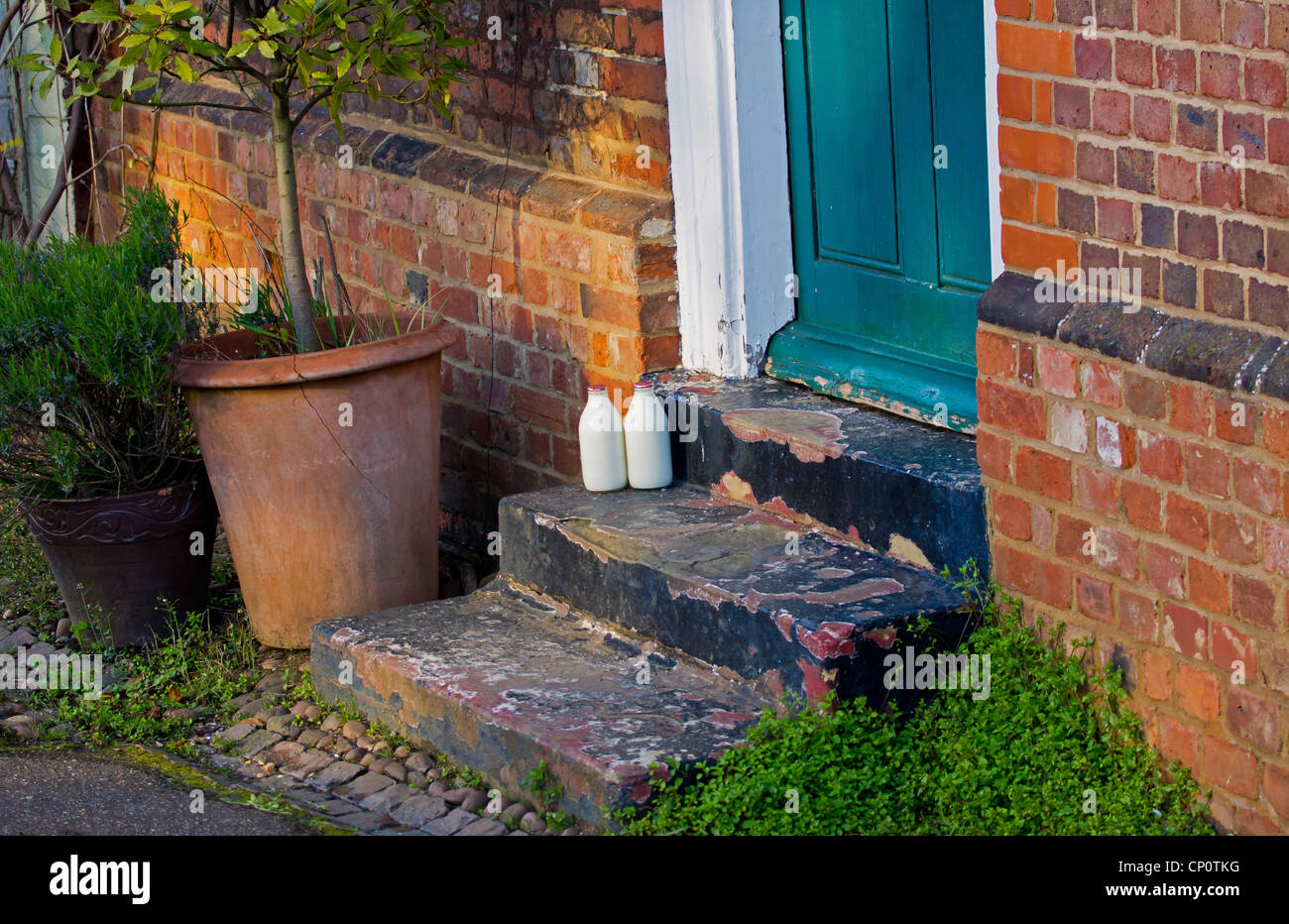 Milk left by the front door Stock Photo - Alamy