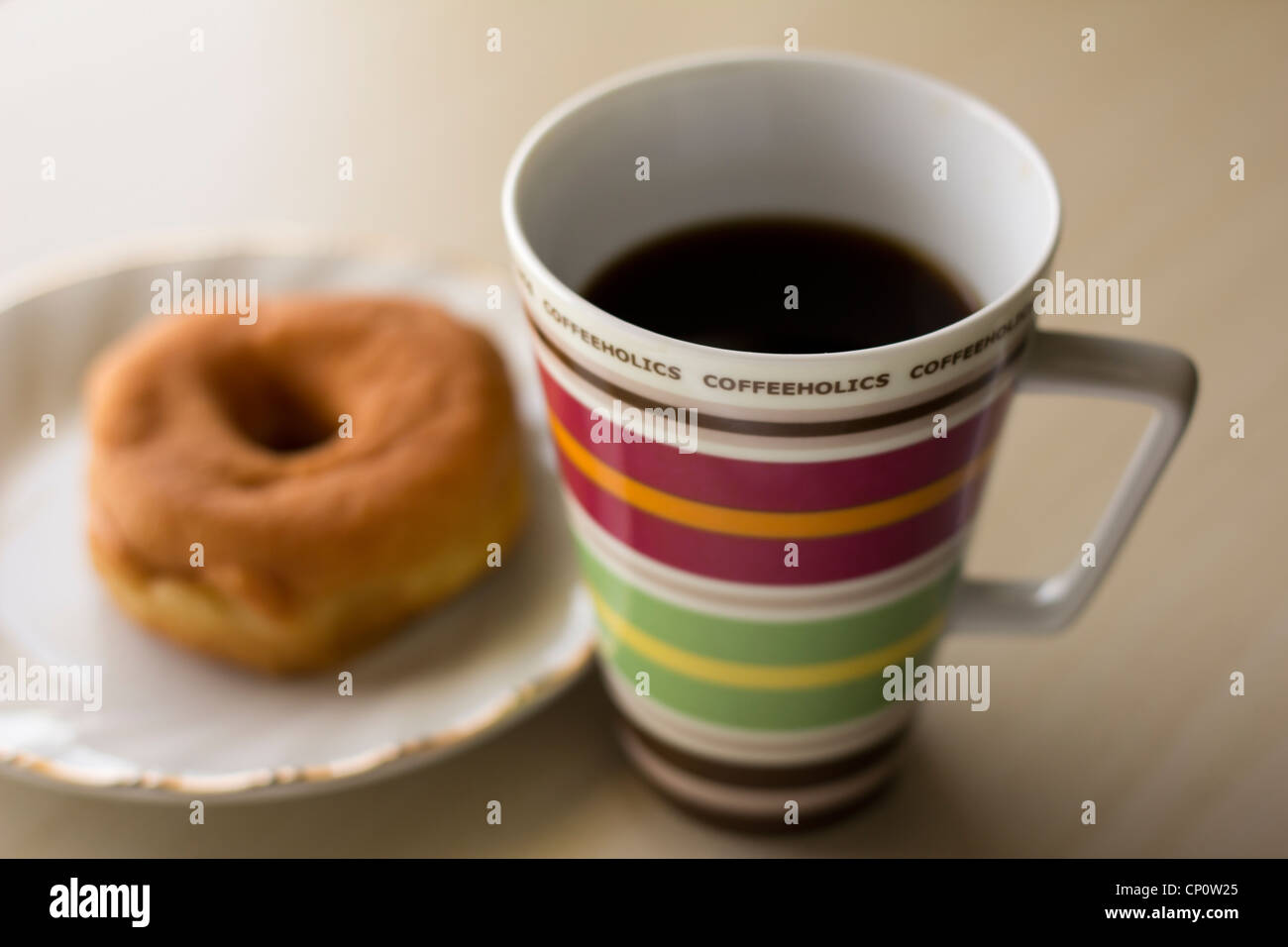 Cup of coffee and a donut Stock Photo - Alamy