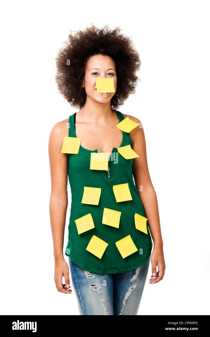 Beautiful young woman covered with post it notes all over the body ...