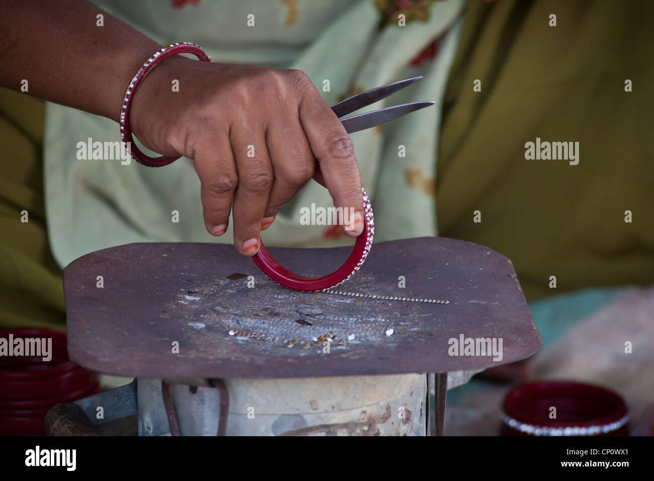 Making lac (resin) bangles in the village of Patan in Rajasthan, India ...