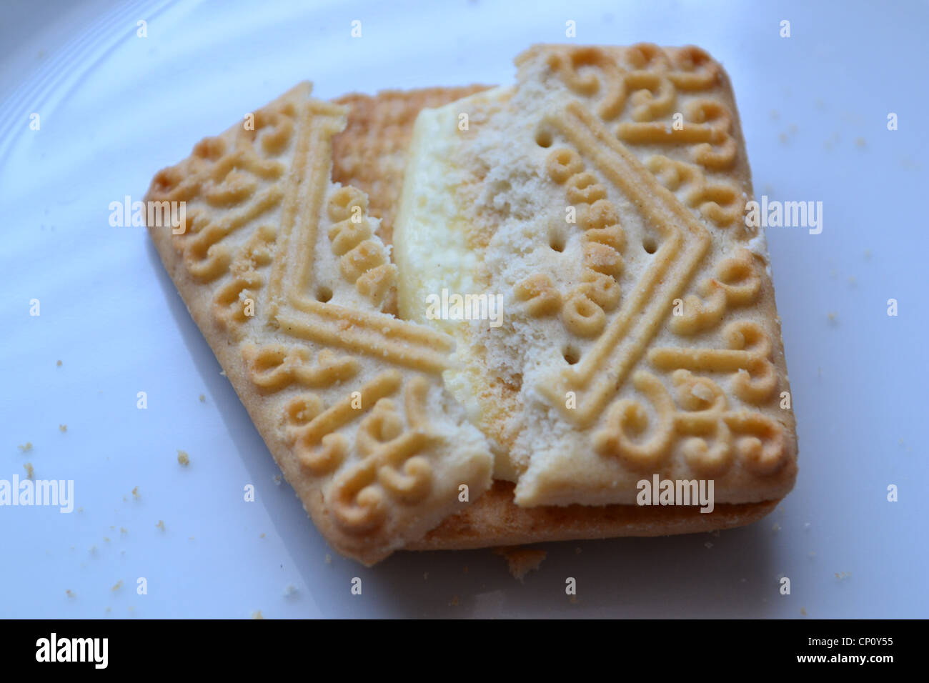 Broken custard cream Stock Photo - Alamy