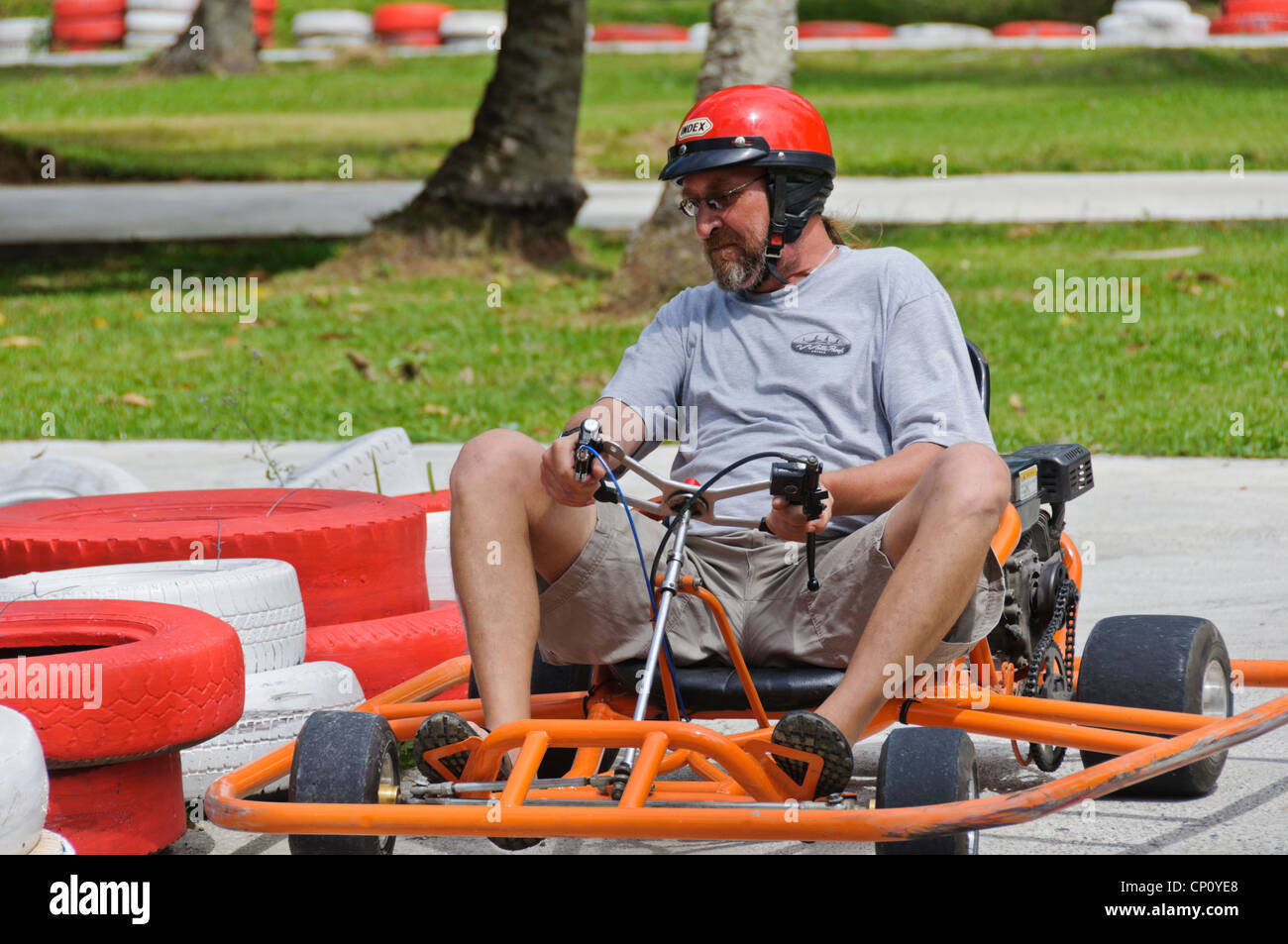 Active middle aged Caucasian Best Ager man enjoying go-kart racing ...