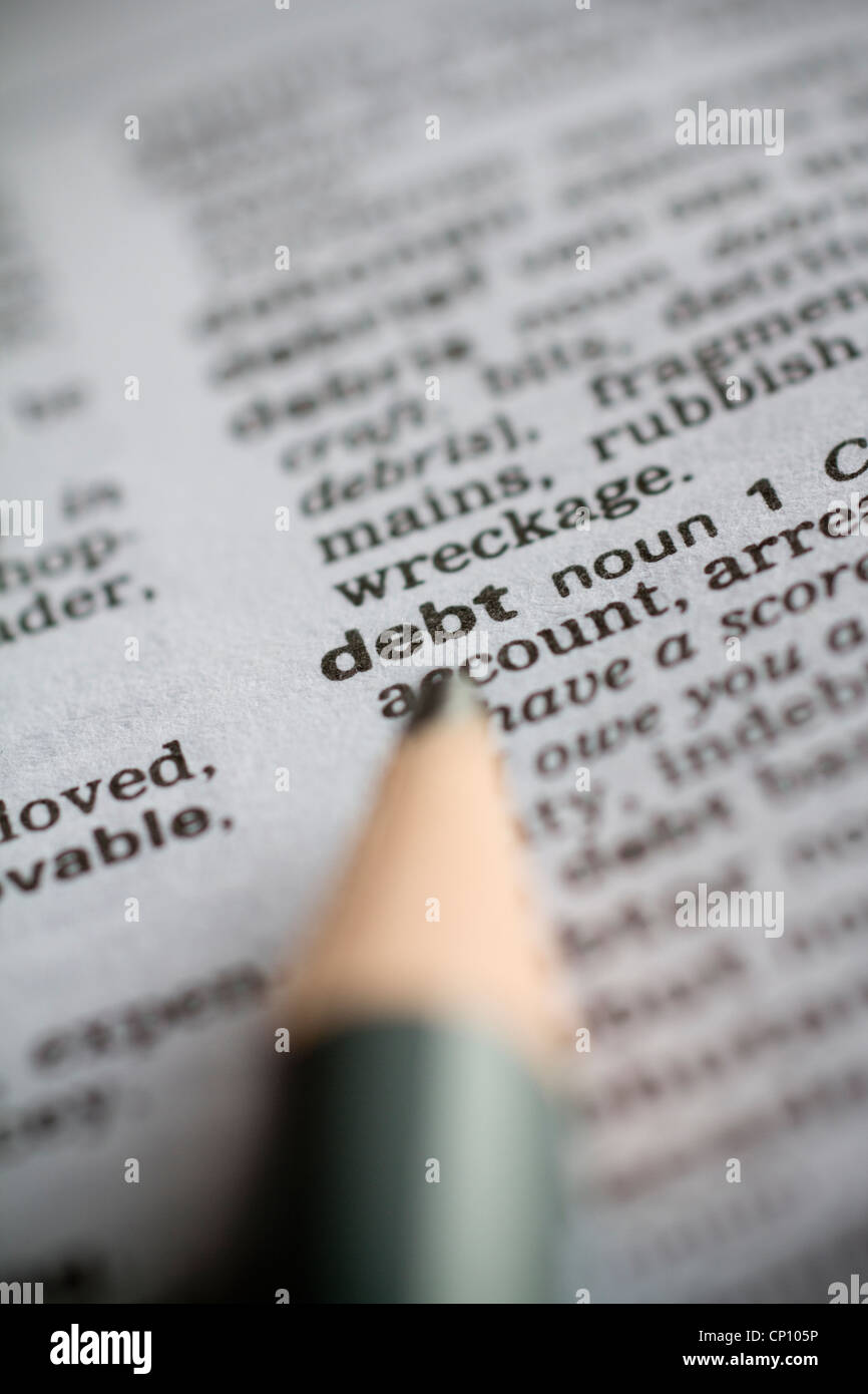 The word "debt" shown in a dictionary with a pencil, symbolising ...