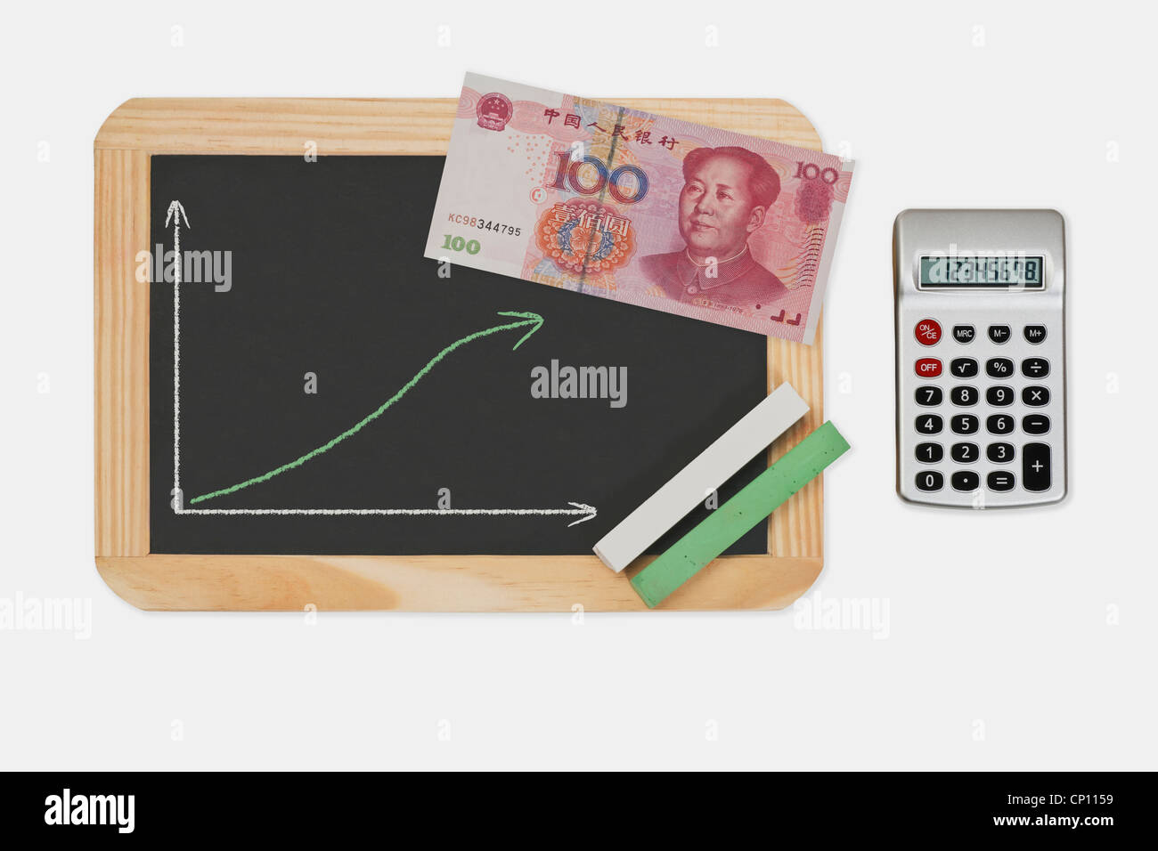 Chalkboard, a chart with an increasing curve. On the chalkboard lies a ...