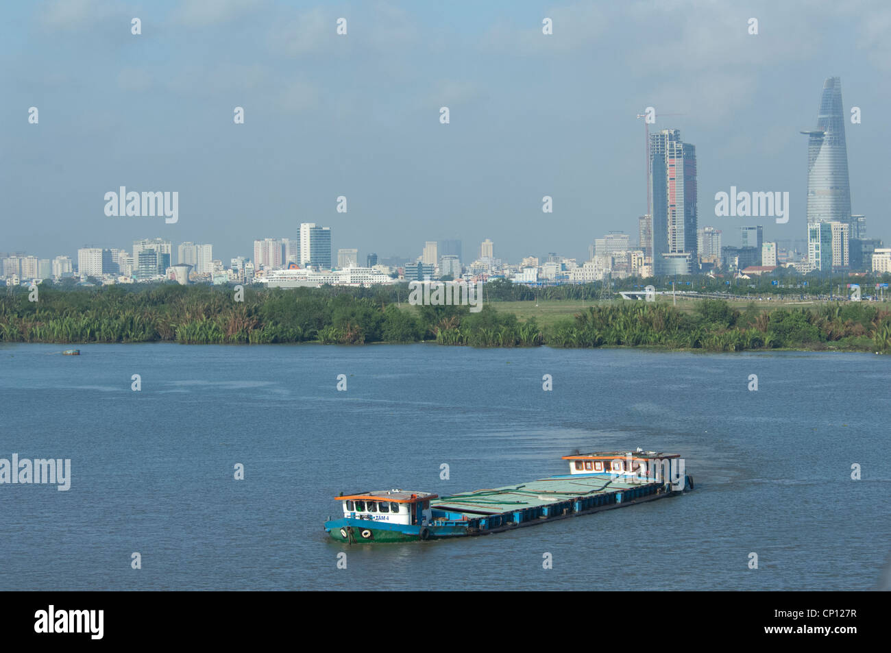 Vietnam, Ho Chi Minh City (aka Saigon). Typical Saigon River view with ...