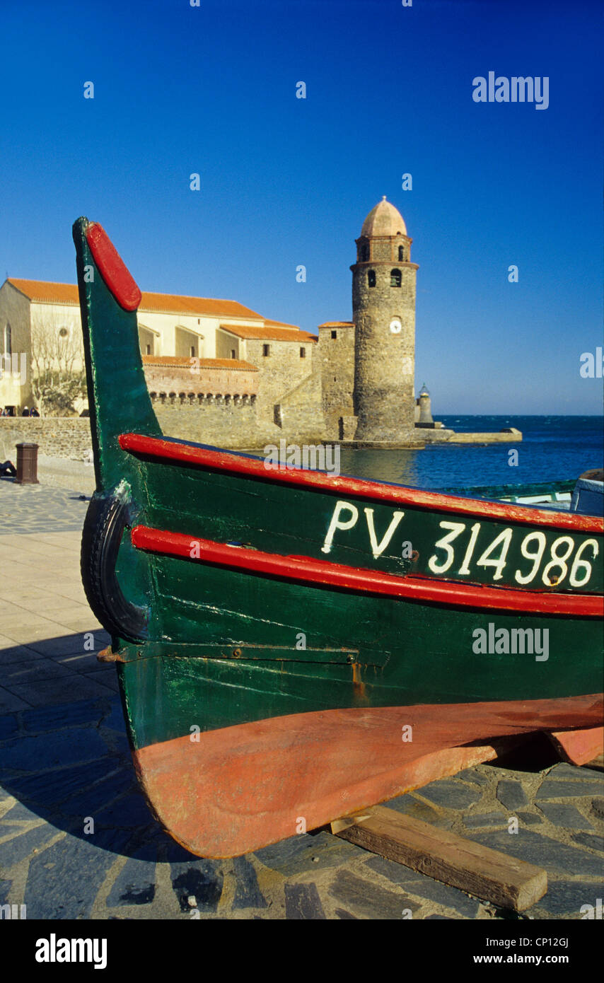 Typical Catalan boat and back Notre Dame des anges church, Port of ...