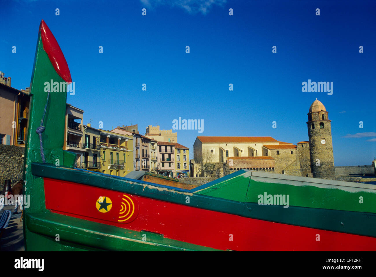 Typical Catalan boat and back Notre Dame des anges church, Port of ...