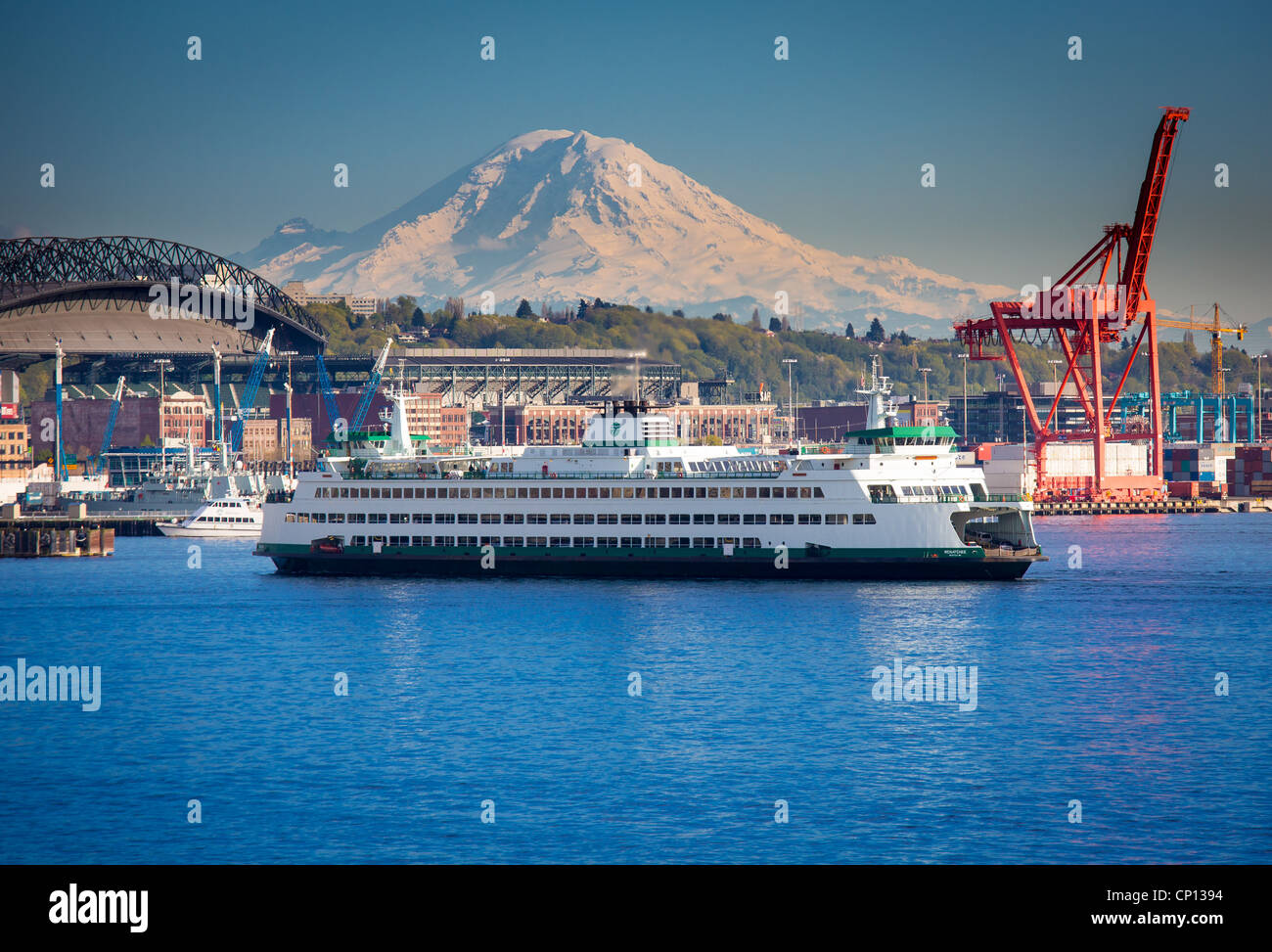 Washington state ferry in Seattle harbor with Mount Rainier in the ...