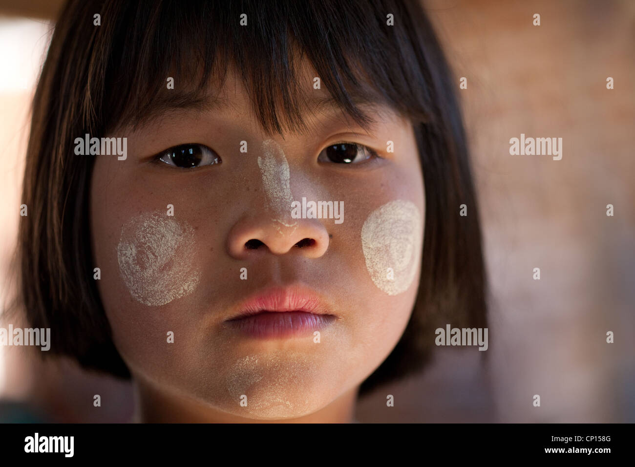 Portrait of a young girl in the village of Kalaw, Burma Myanmar. She is ...