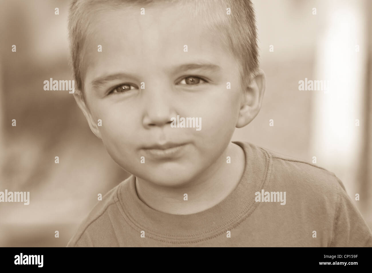Head shot image of four year old autistic boy smirking Stock Photo - Alamy
