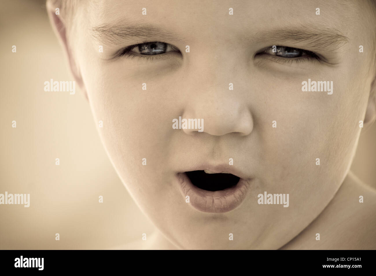 A close up of a four year old autistic boy and his beautiful blue eyes ...