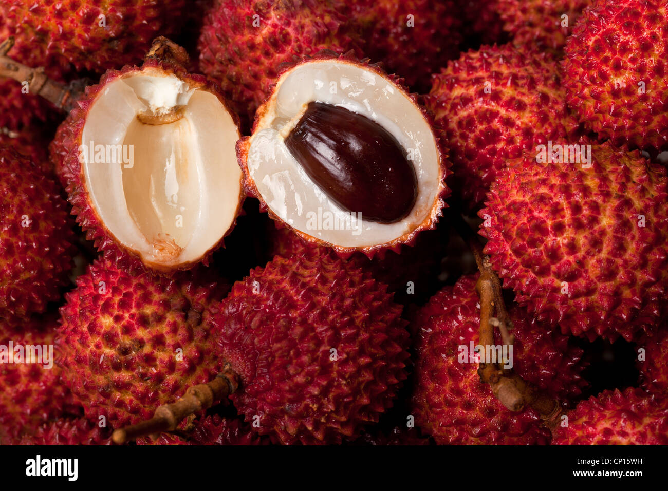 Halved lychee amid a pile of lychees Stock Photo - Alamy