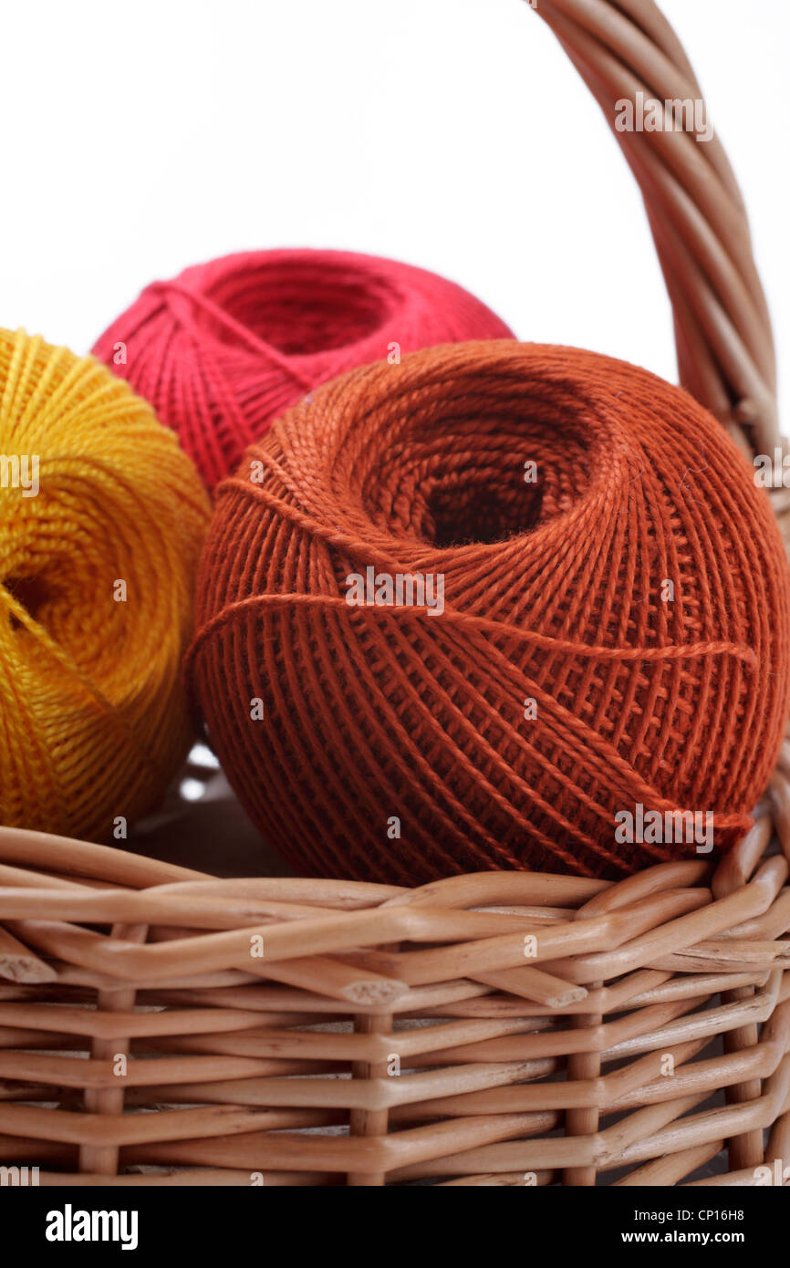 yarn for crochet in a basket on a white background Stock Photo - Alamy