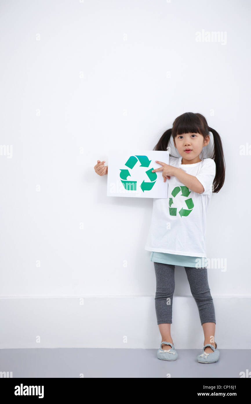 A girl wearing recycling shirt with recycling mark Stock Photo - Alamy