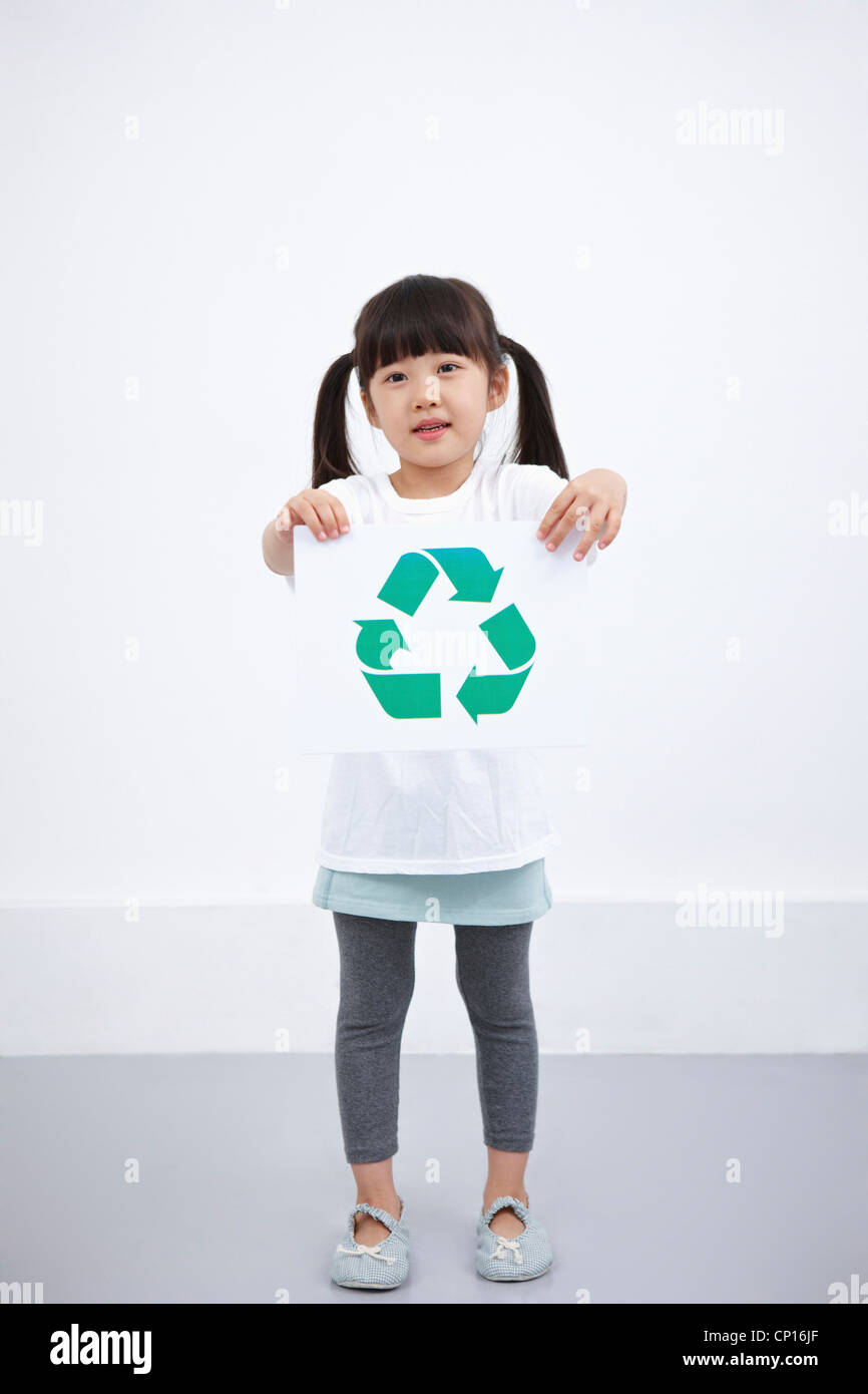 A girl wearing recycling shirt with recycling mark Stock Photo - Alamy