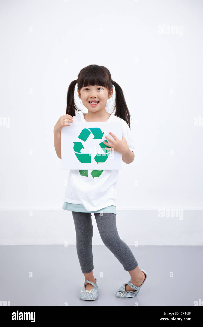 A girl wearing recycling shirt with recycling mark Stock Photo - Alamy