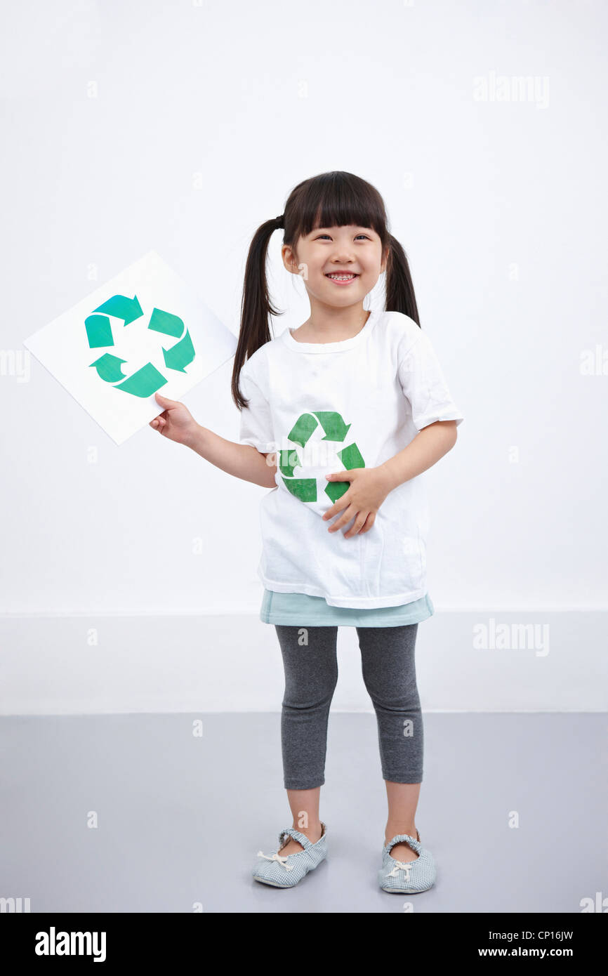 A girl wearing recycling shirt with recycling mark Stock Photo - Alamy