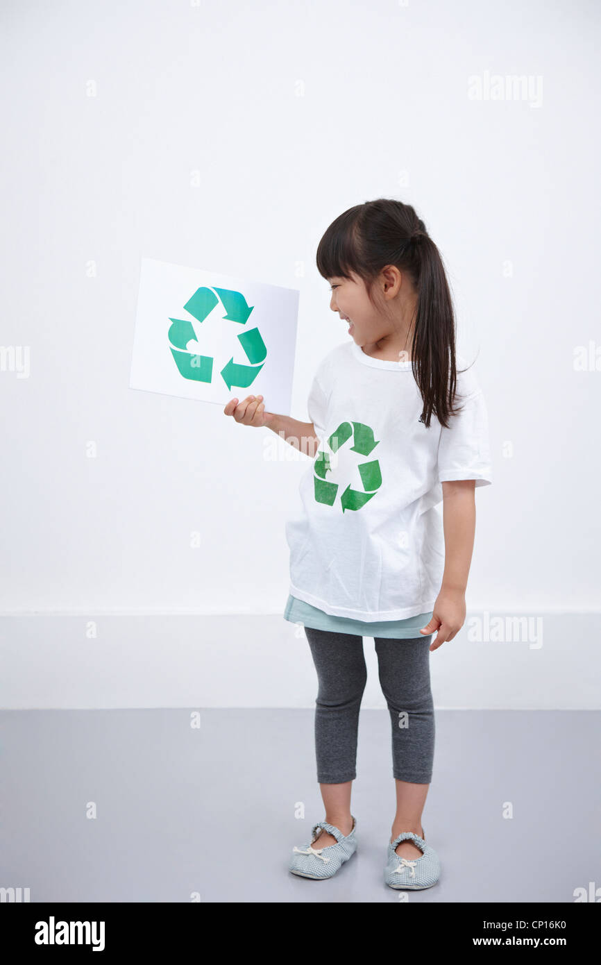 A girl wearing recycling shirt with recycling mark Stock Photo - Alamy