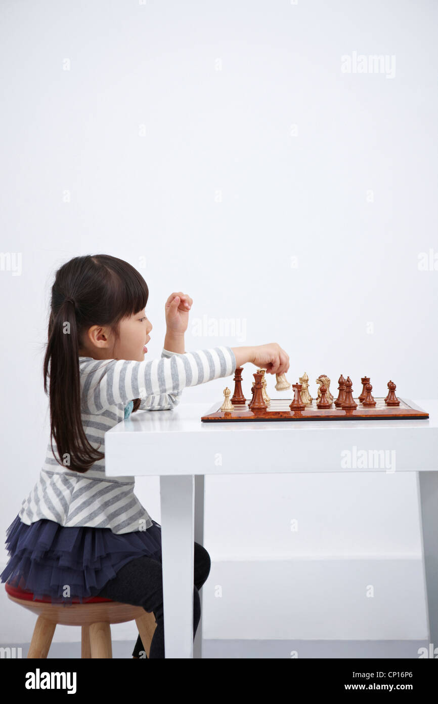 A girl playing chess game Stock Photo - Alamy