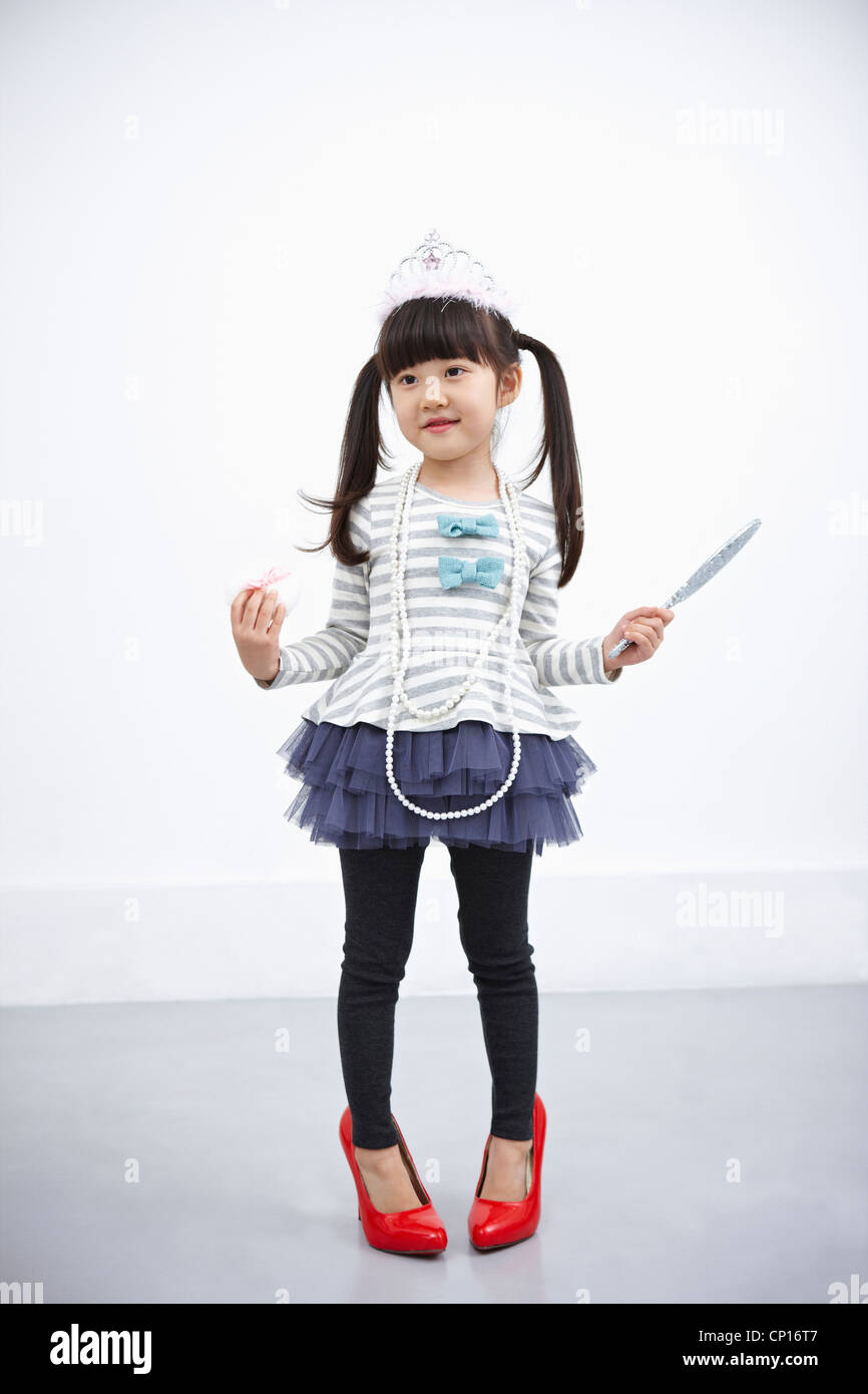 A girl with accessories and red shoes on Stock Photo - Alamy