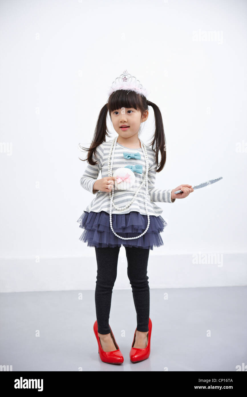 A girl with accessories and red shoes on Stock Photo - Alamy