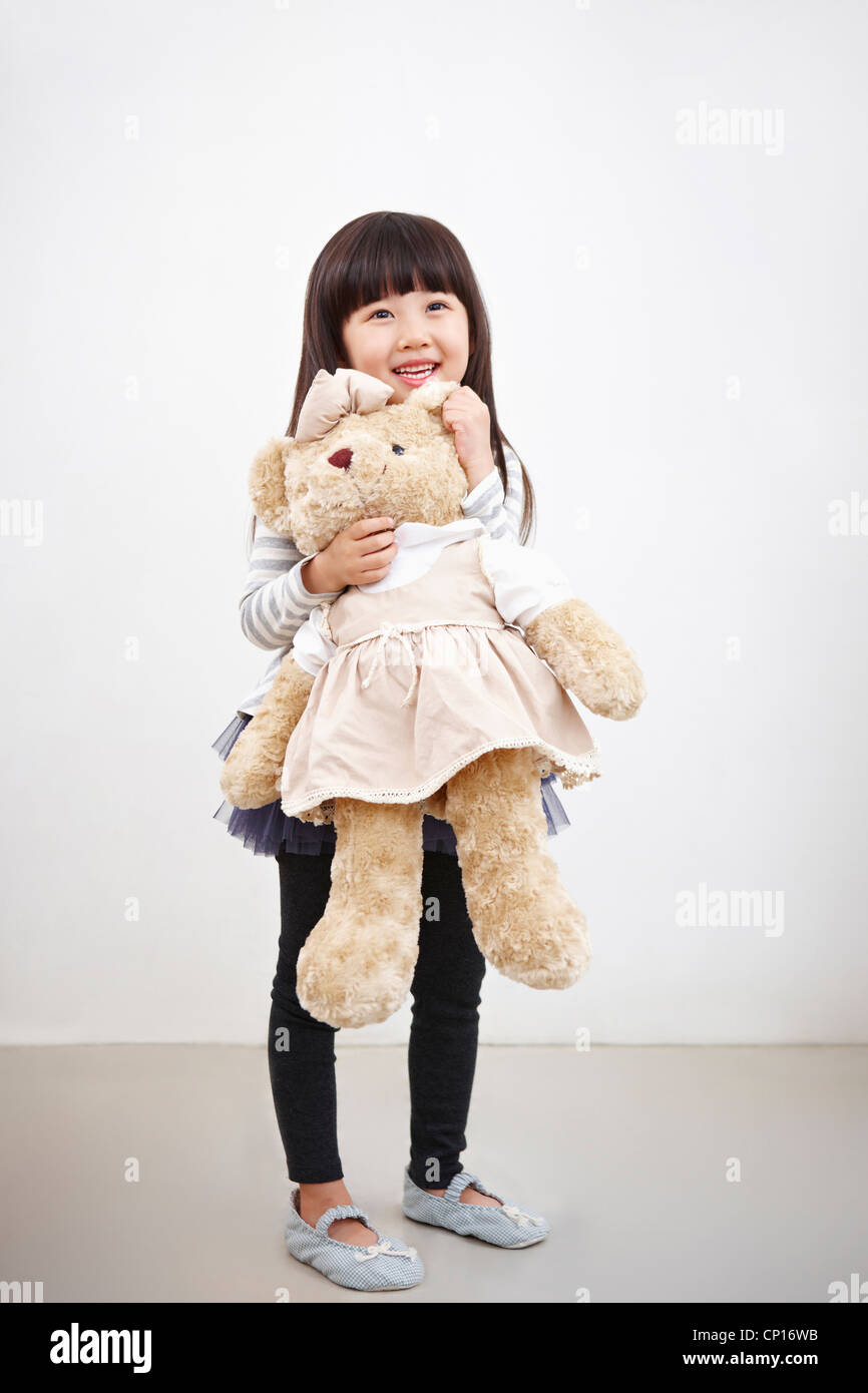 A girl hugging teddy bear Stock Photo - Alamy