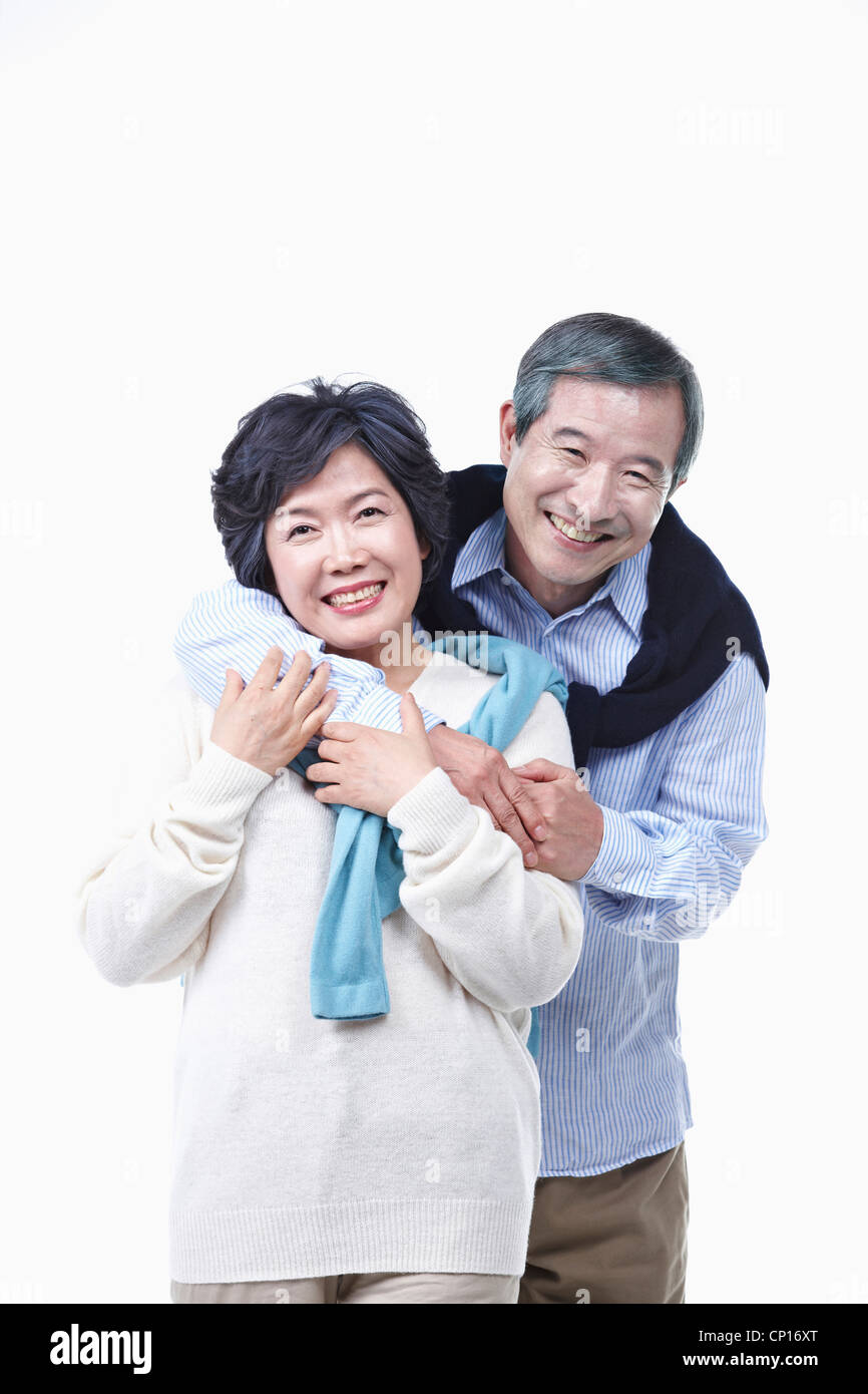 An old couple hugging each other Stock Photo - Alamy