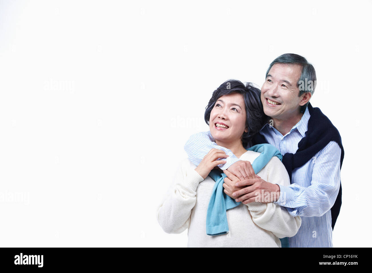 An old couple hugging each other Stock Photo - Alamy