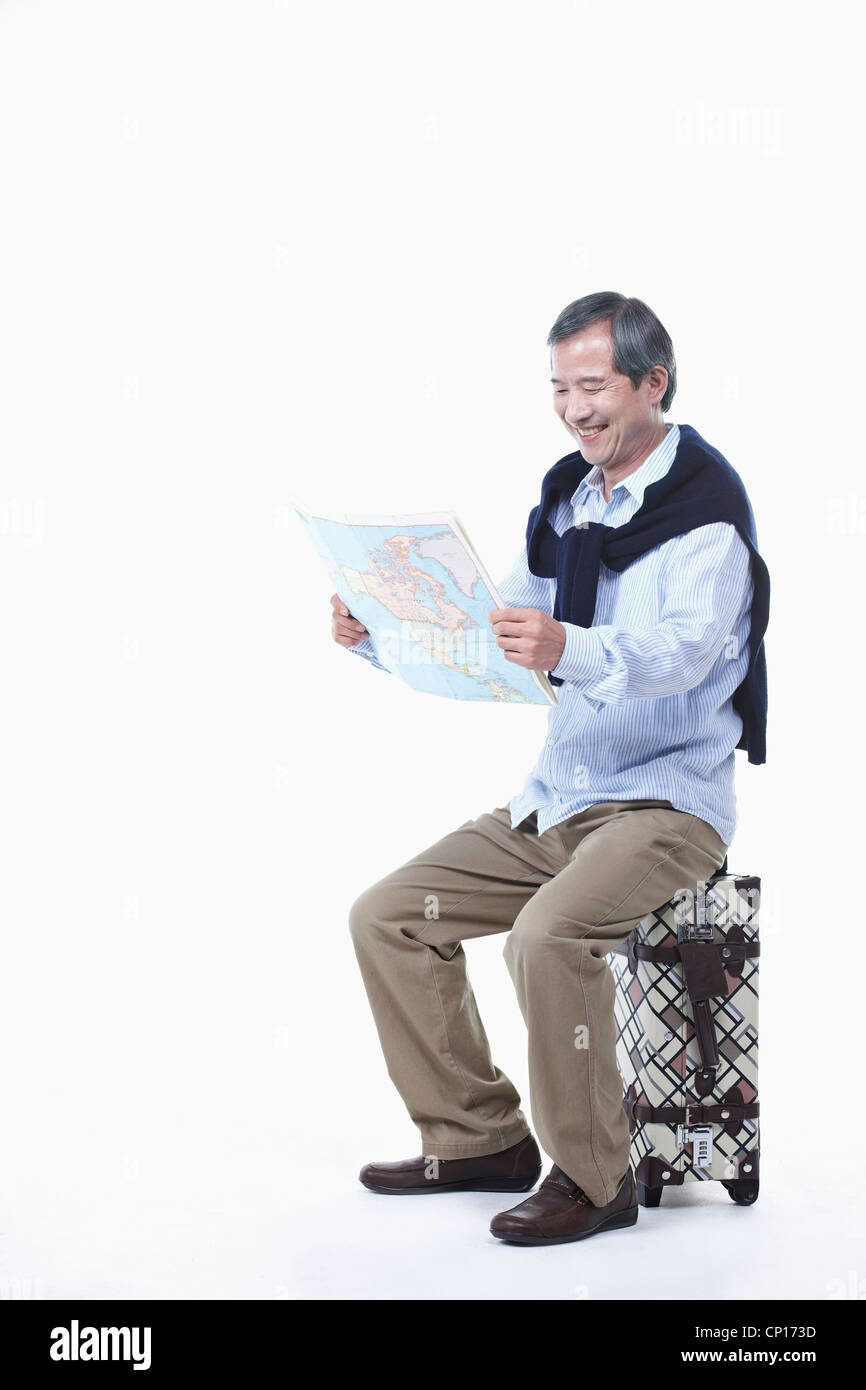 An old man going on travel Stock Photo - Alamy