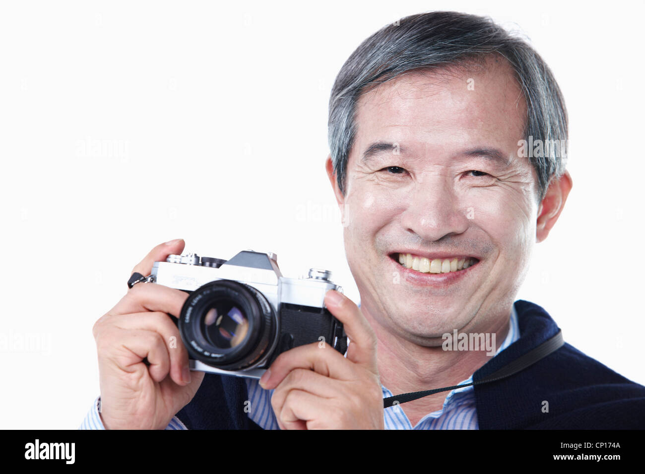 An old man photographing with camera Stock Photo - Alamy