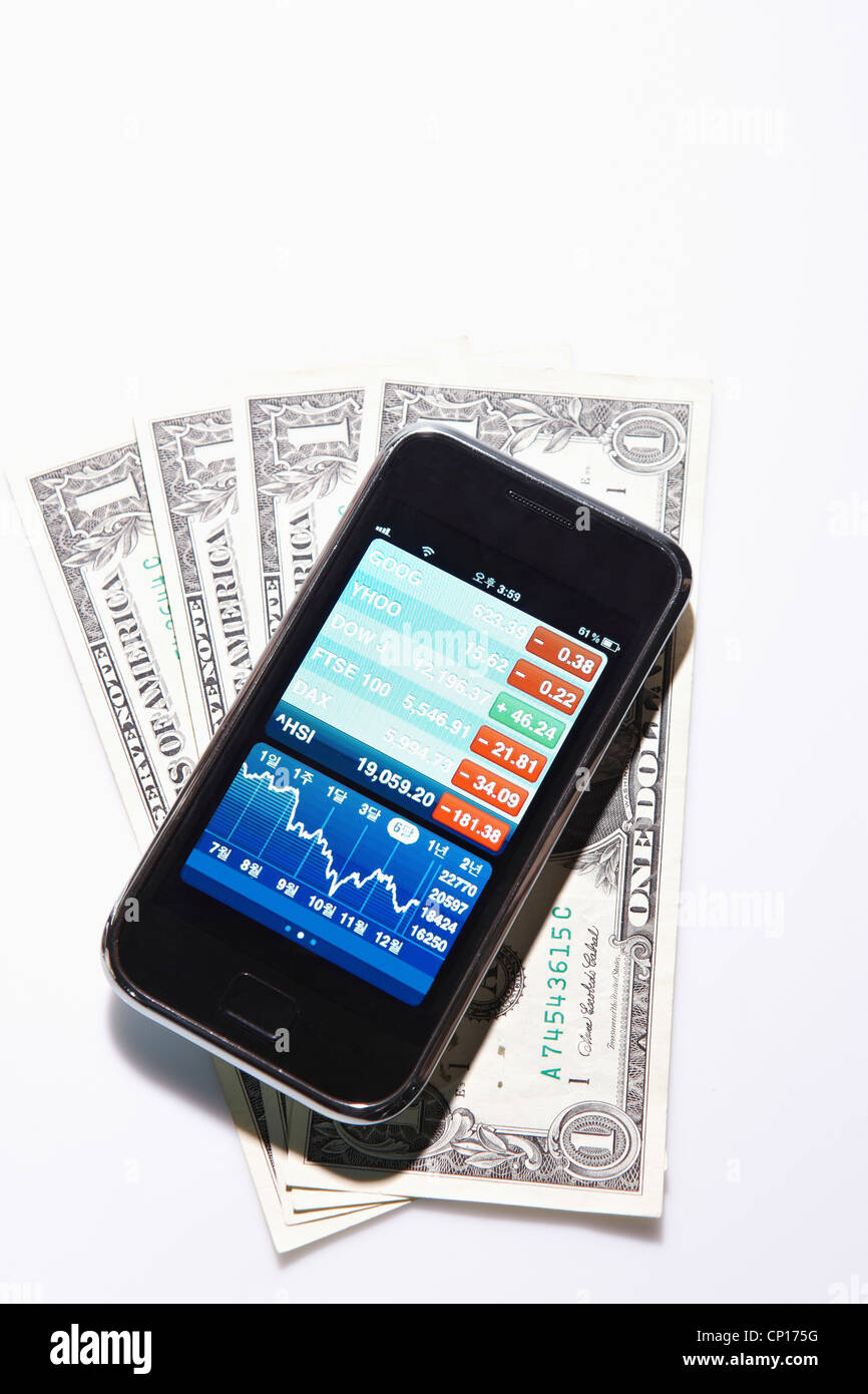 Smartphone and money Stock Photo - Alamy