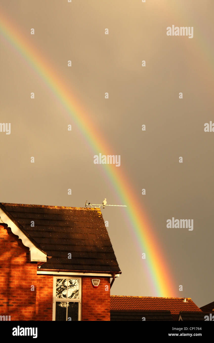 a rainbow over a house Stock Photo - Alamy